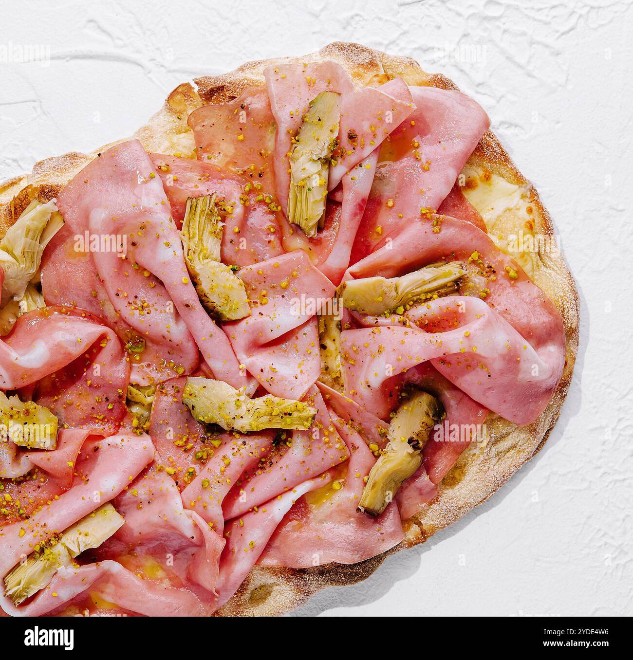 square pizza with ham and artichokes top view Stock Photo - Alamy