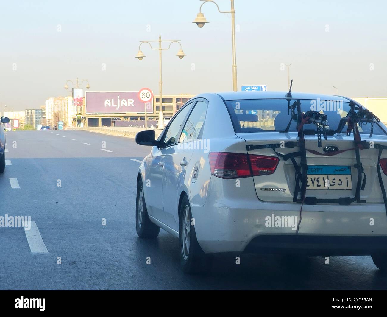 Cairo, Egypt, October 12 2024: A KIA Cerato car with a bicycle holder bike rack on its back, KIA ...