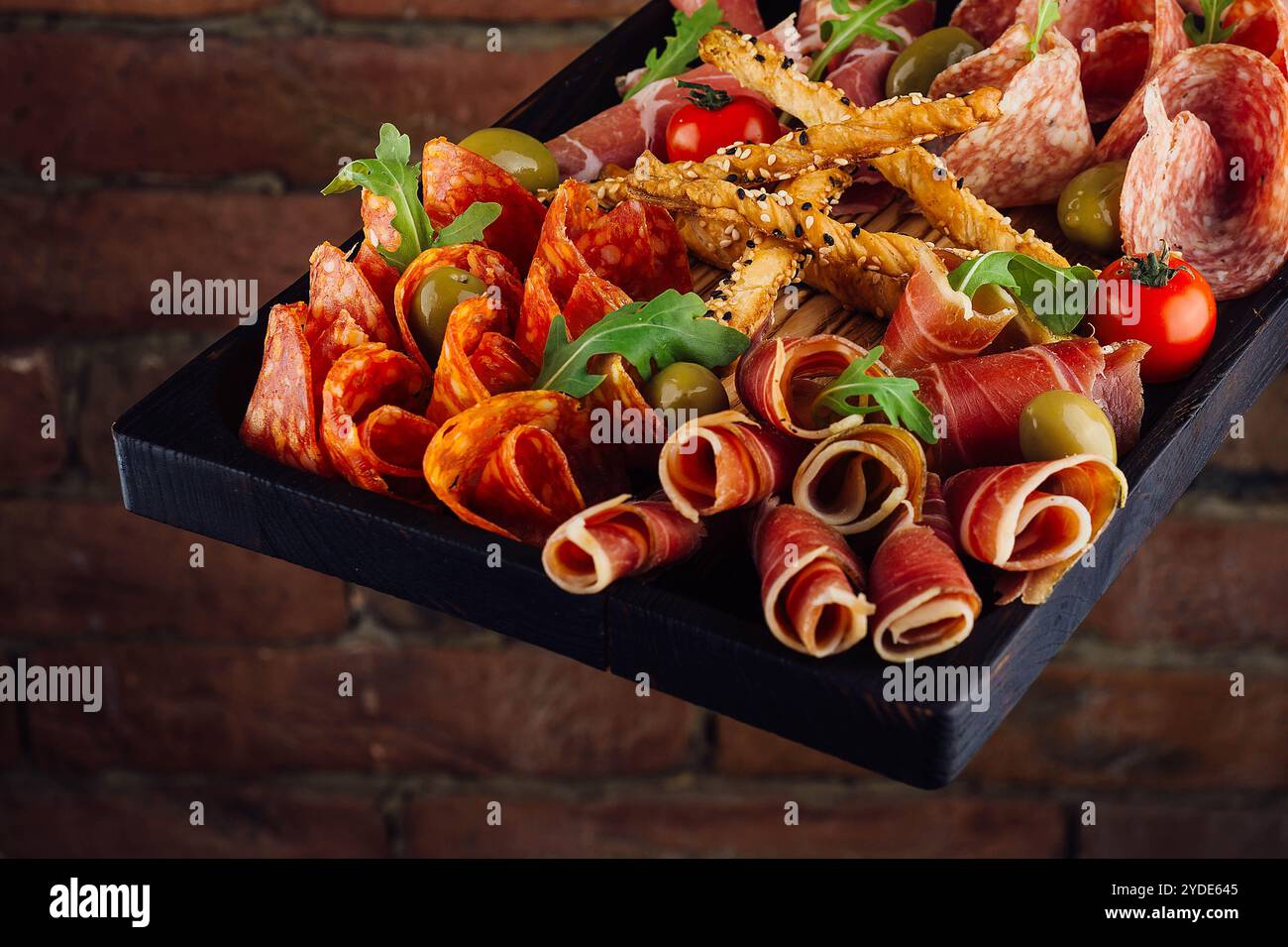 Traditional spanish jamon, prosciutto crudo, italian salami, parma ham ...