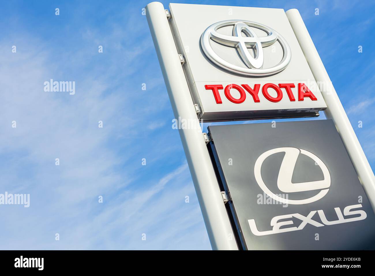 Toyota brand logo on bright blue sky background Stock Photo - Alamy