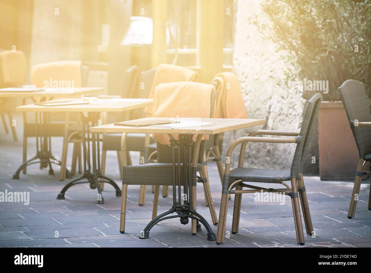 Outdoor street cafe tables Stock Photo - Alamy