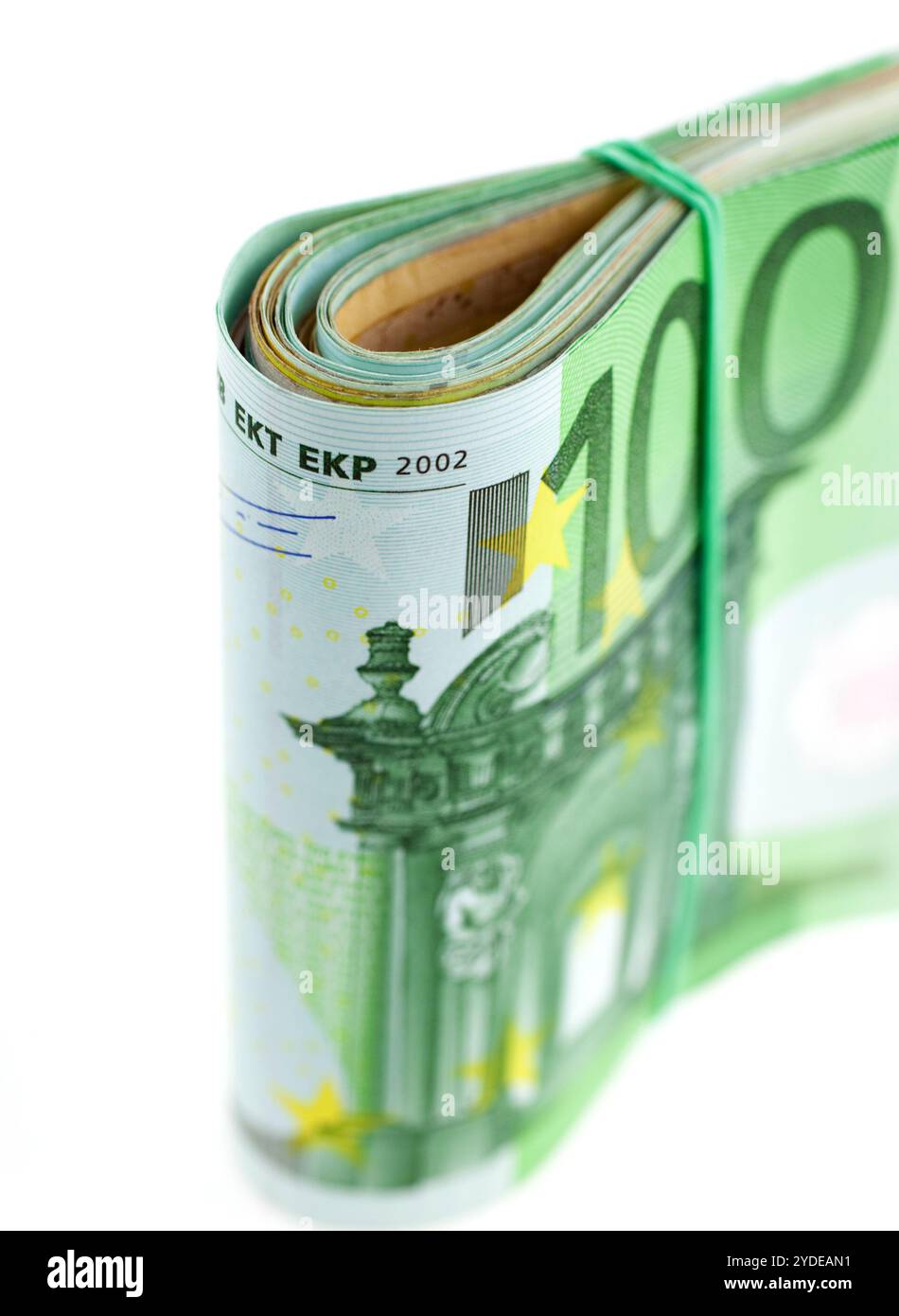 Rolled with rubber euro notes Stock Photo - Alamy
