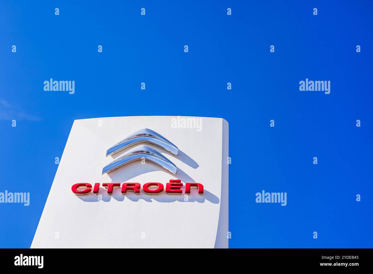 Citroen brand logo on clear blue sky background Stock Photo - Alamy