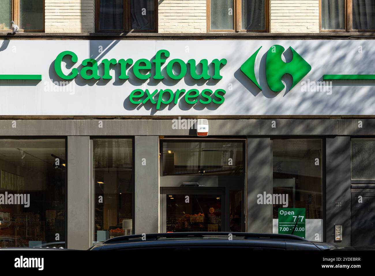 Carrefour Express store logo sign. Carrefour is a French group, and a ...