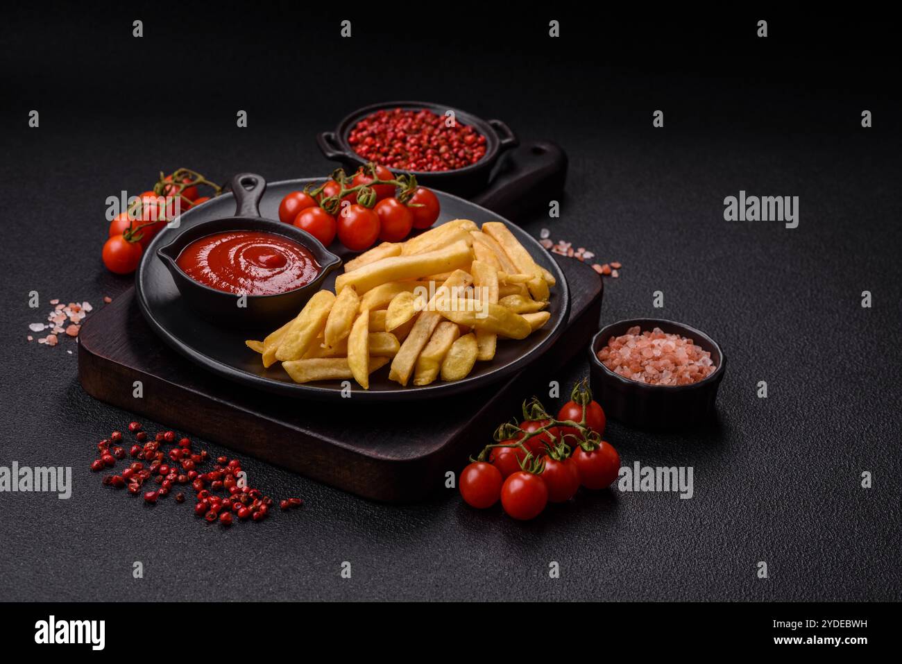 Fast food french fries with salt and spices Stock Photo - Alamy