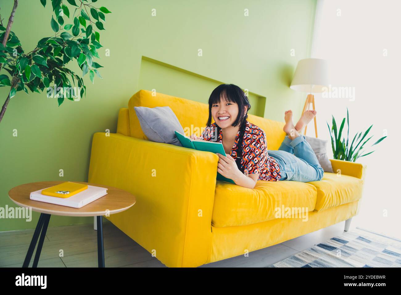 Full size photo of pretty young woman laying couch notepad weekend ...