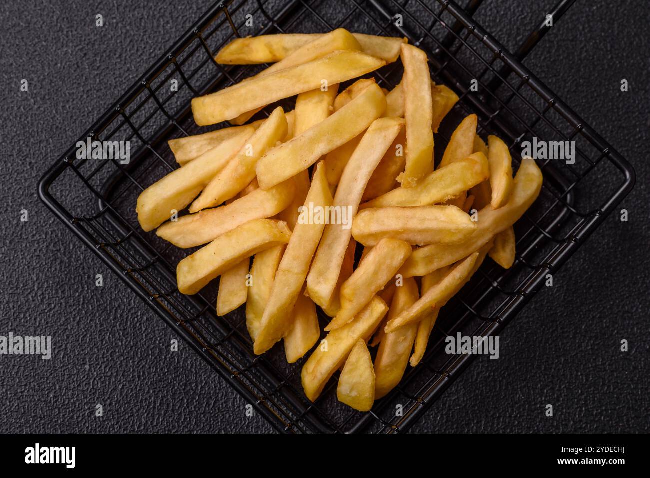 Fast food french fries with salt and spices Stock Photo - Alamy