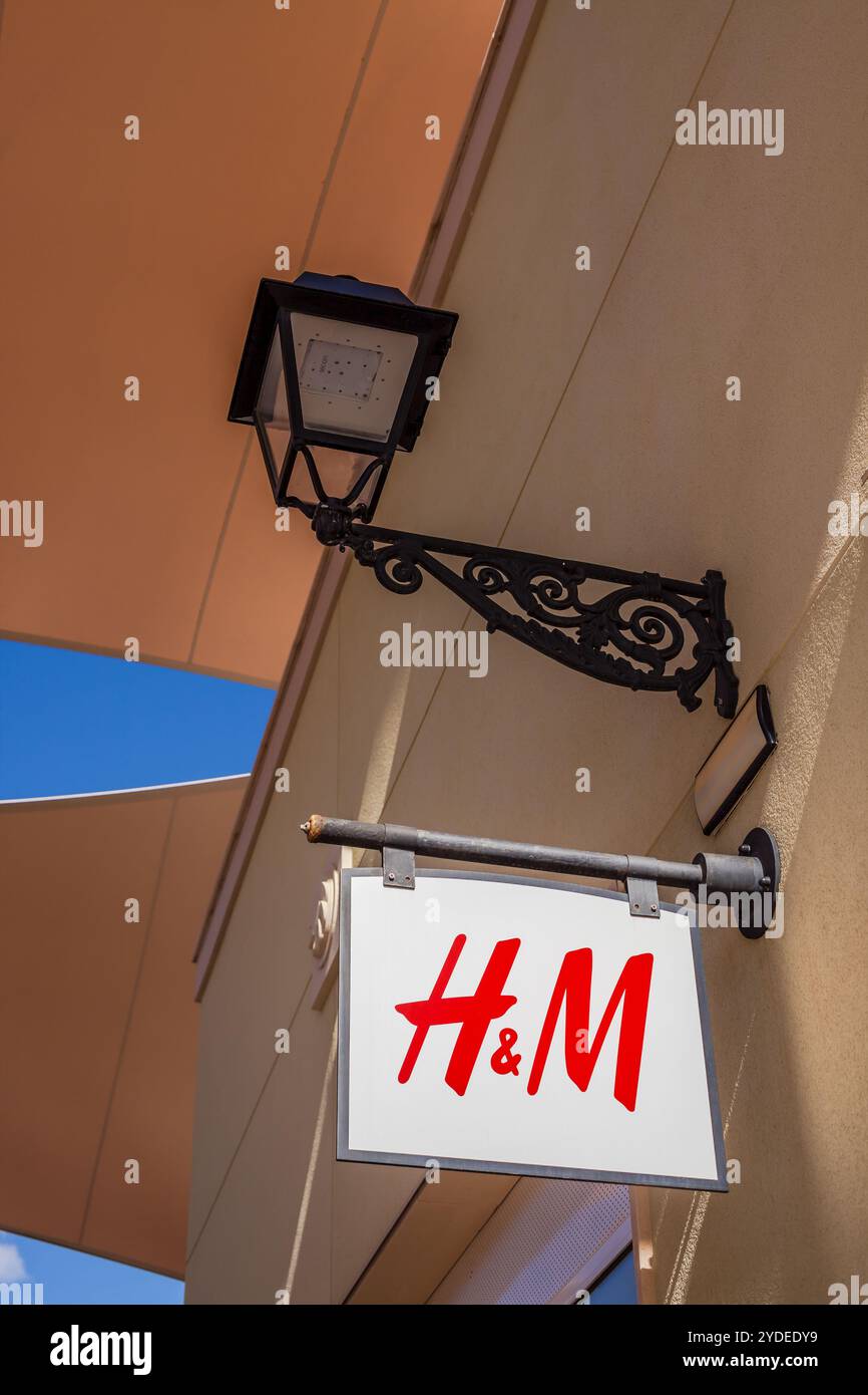 HM store brand logo at its building Stock Photo - Alamy