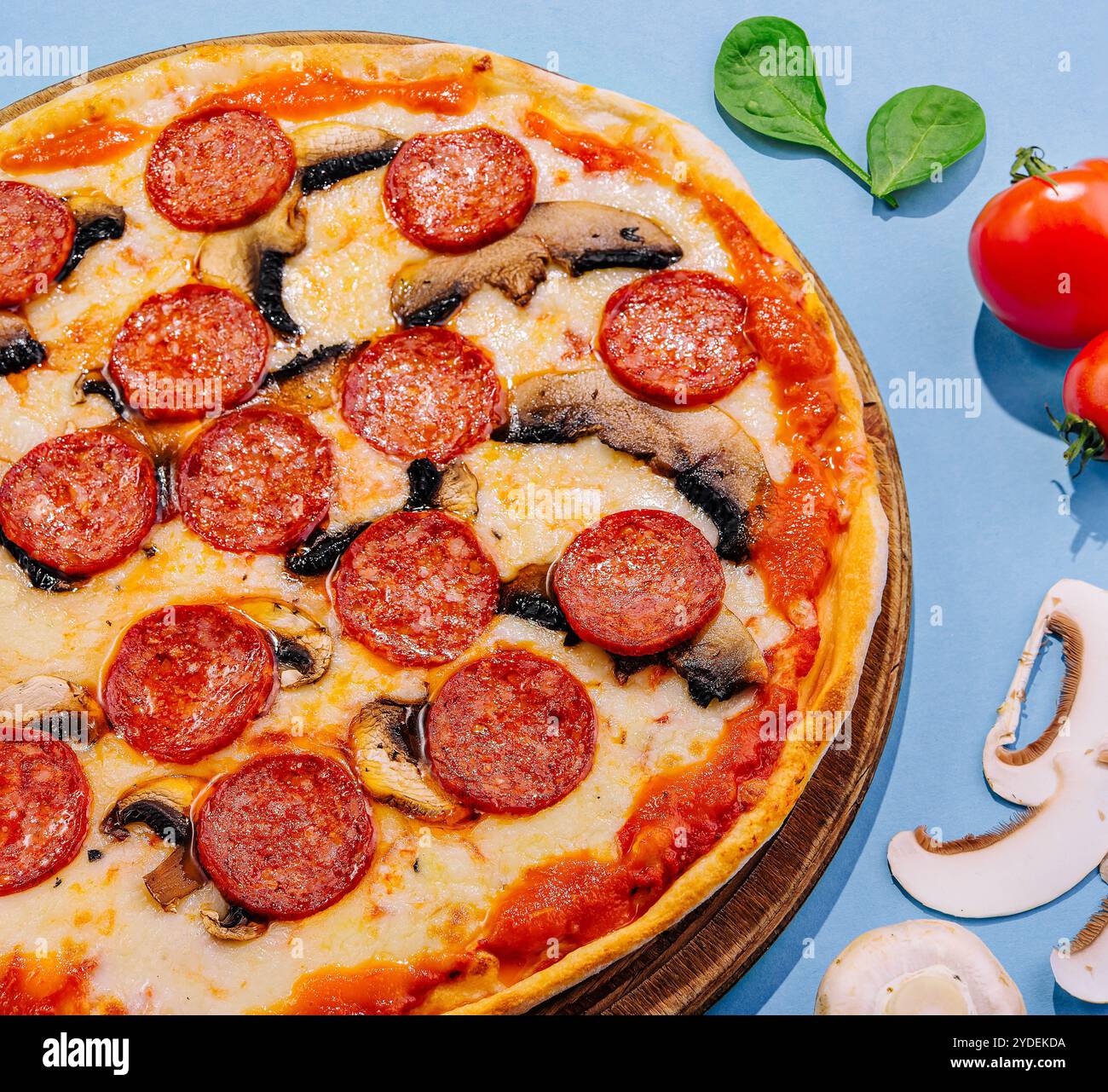 Fresh tasty pizzas on top view Stock Photo - Alamy