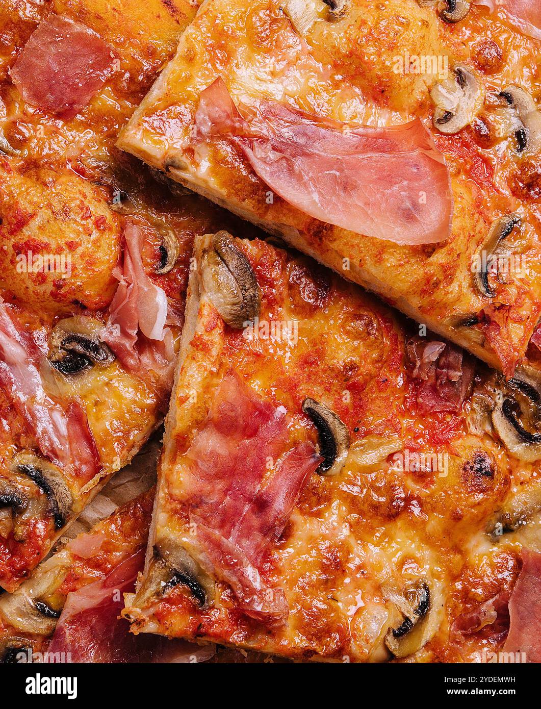 Long pizza mix lies close up top view Stock Photo - Alamy
