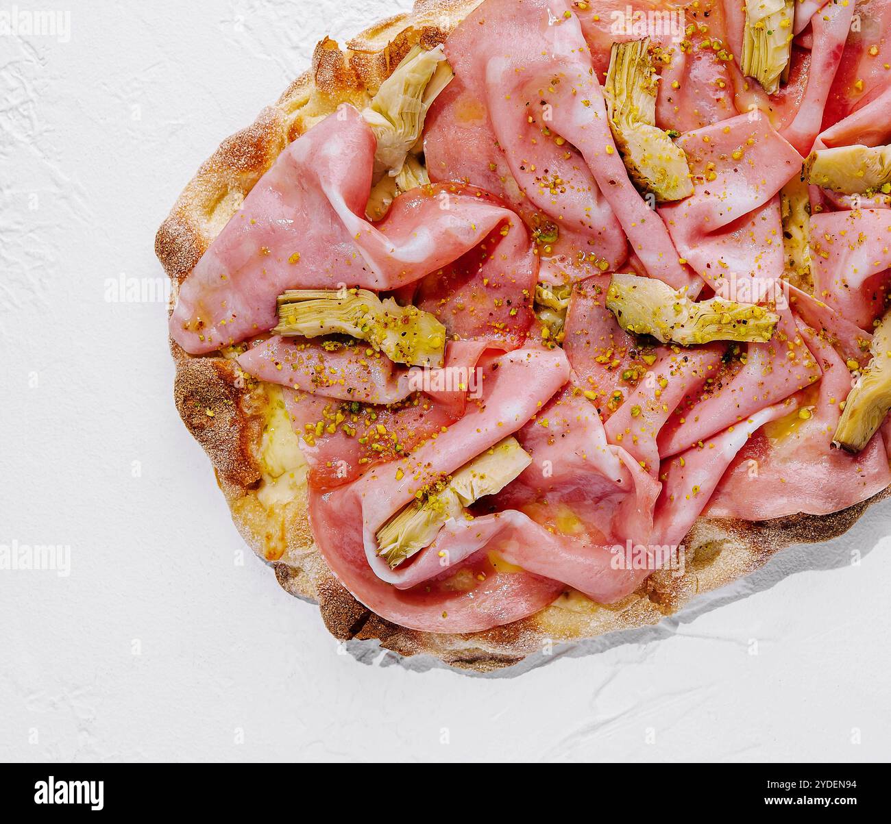 square pizza with ham and artichokes top view Stock Photo - Alamy