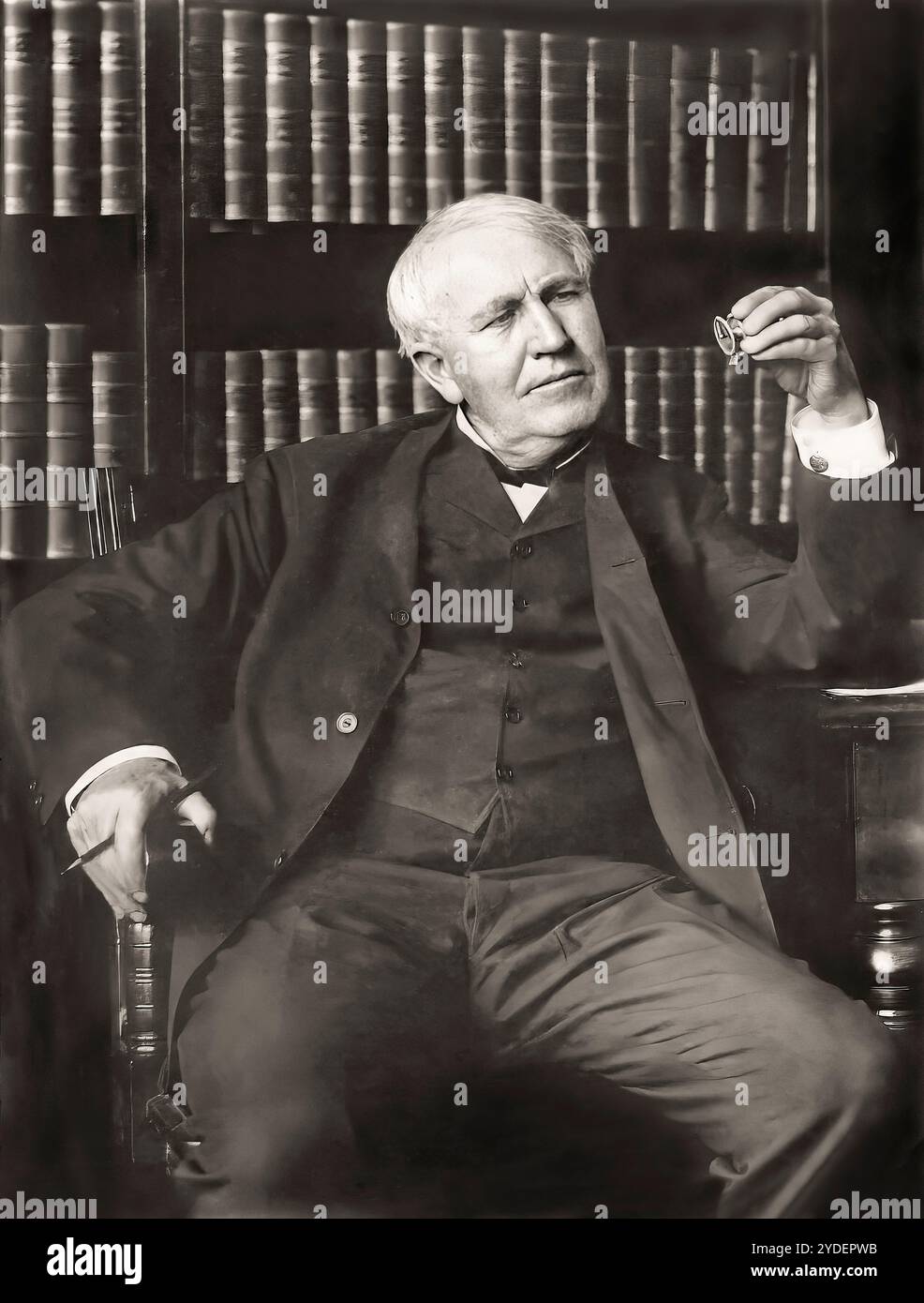 Thomas Alva Edison examining his phonograph recording apparatus ...
