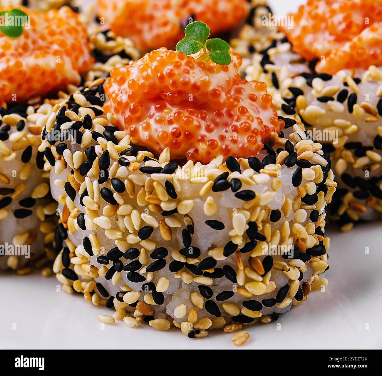 sushi rolls with salmon pieces and red caviar Stock Photo - Alamy