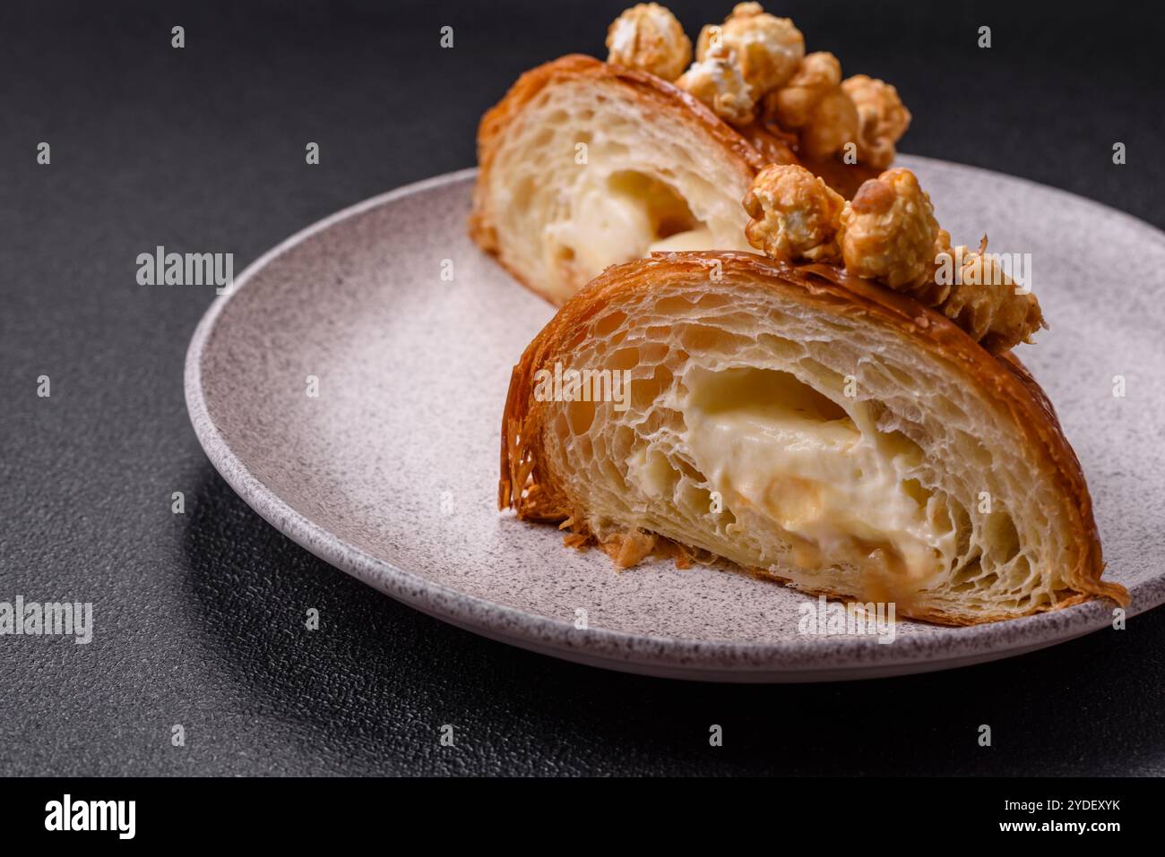 Sweet crispy croissant with salted caramel and glazed popcorn Stock ...