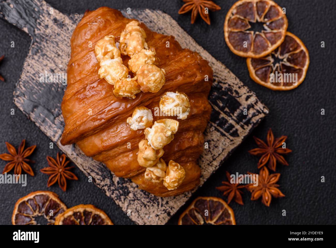Sweet crispy croissant with salted caramel and glazed popcorn Stock ...