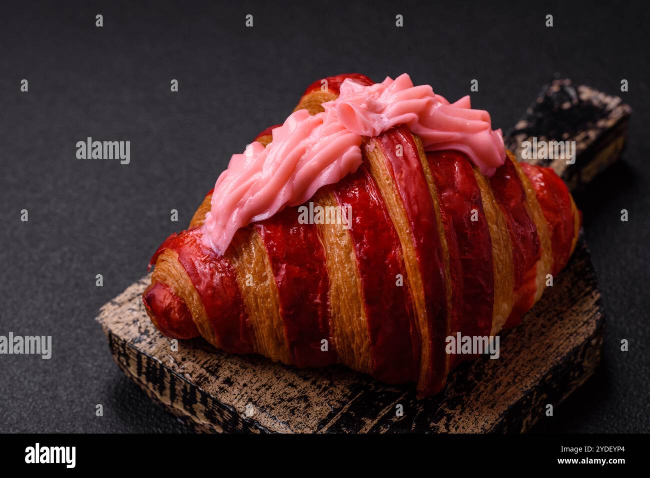 Crispy fresh red croissant with cream and strawberries Stock Photo - Alamy
