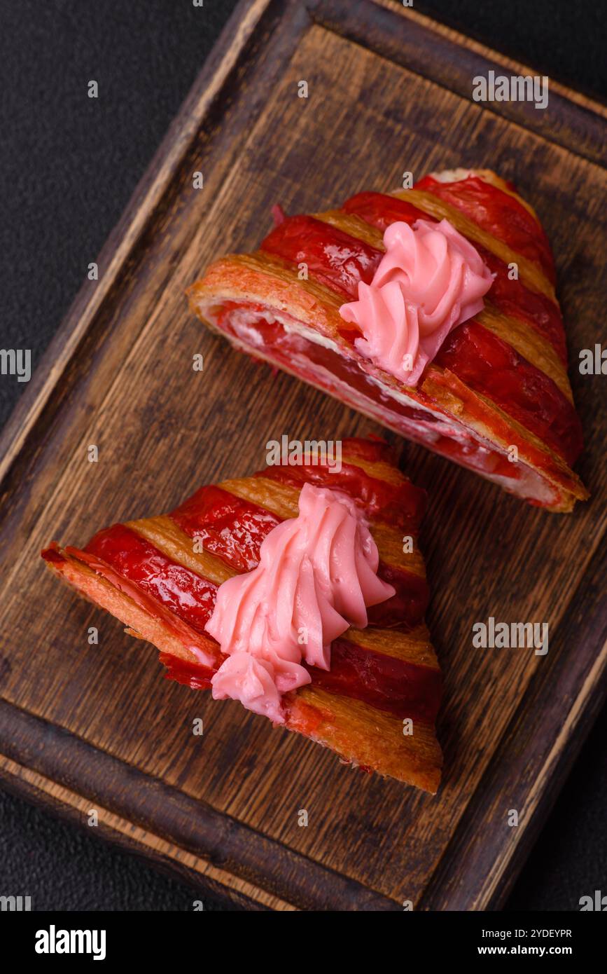 Crispy fresh red croissant with cream and strawberries Stock Photo - Alamy