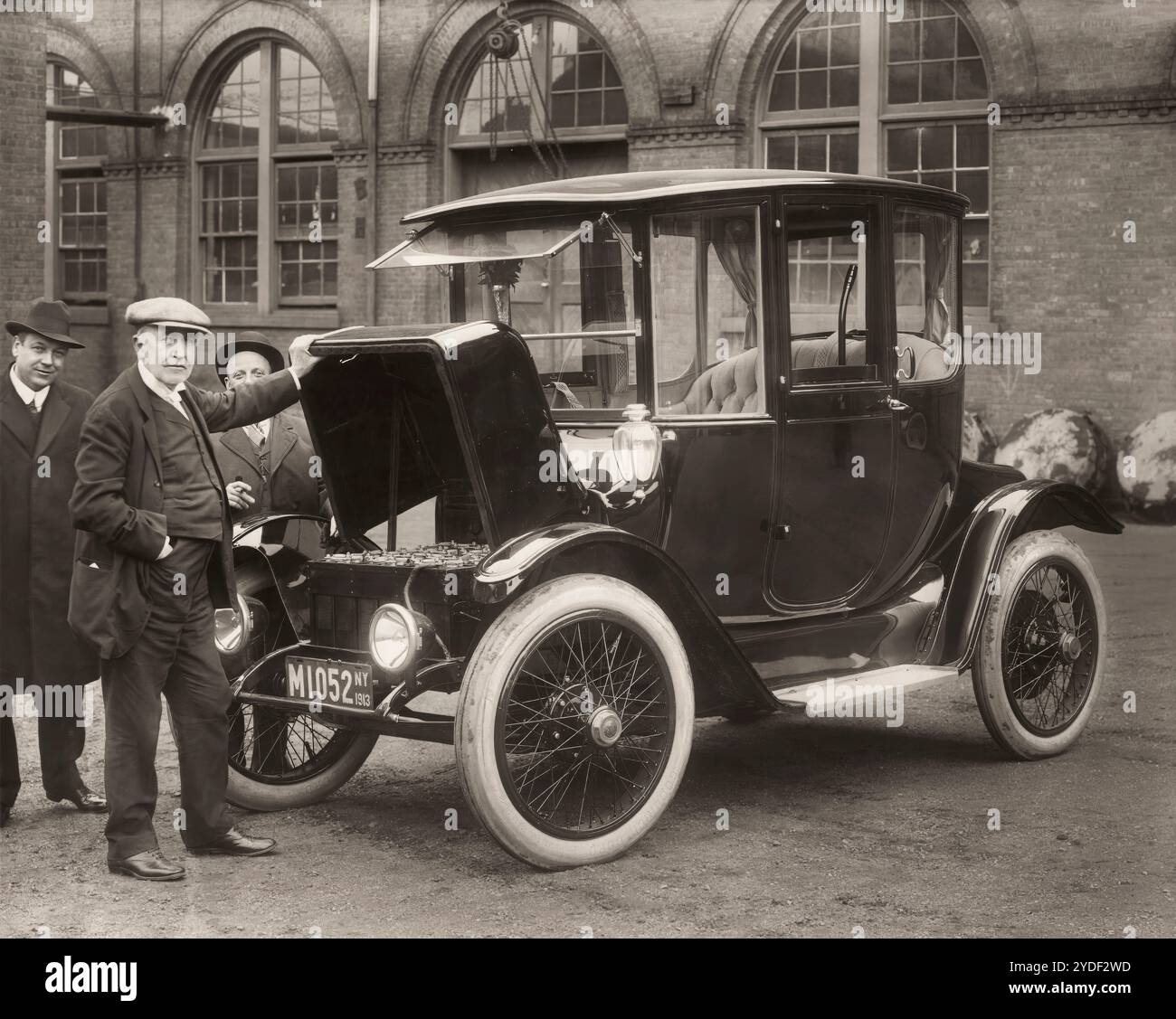 Thomas Alva Edison displaying storage batteries of the power Detroit ...