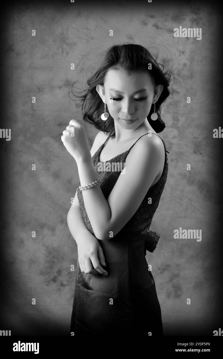 Black and white Beautiful asian chinese girl, dressed in red in a gray ...