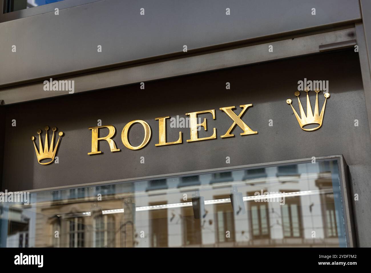 Rolex gold metal logo sign. Rolex SA is a British-founded Swiss watch ...