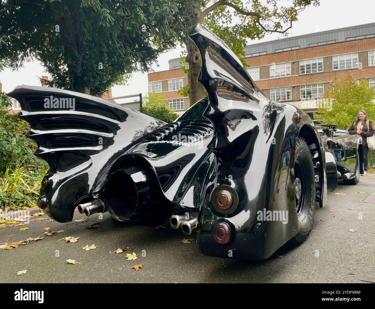a replica of the bat mobile in a church grounds for use as a prop for a ...