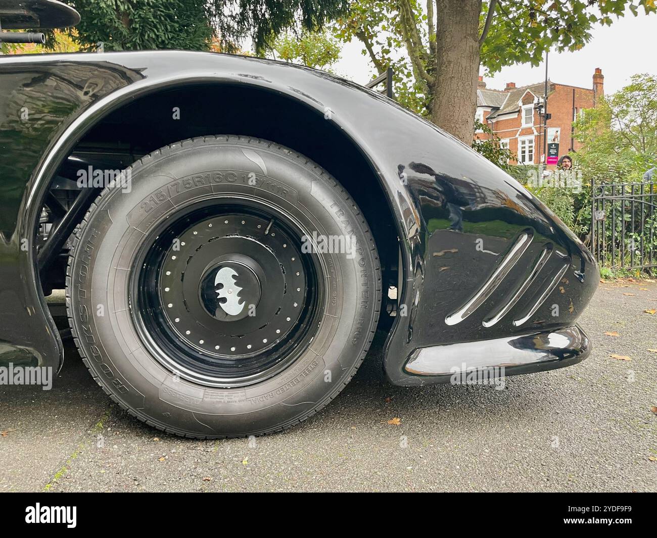 a replica of the bat mobile in a church grounds for use as a prop for a ...