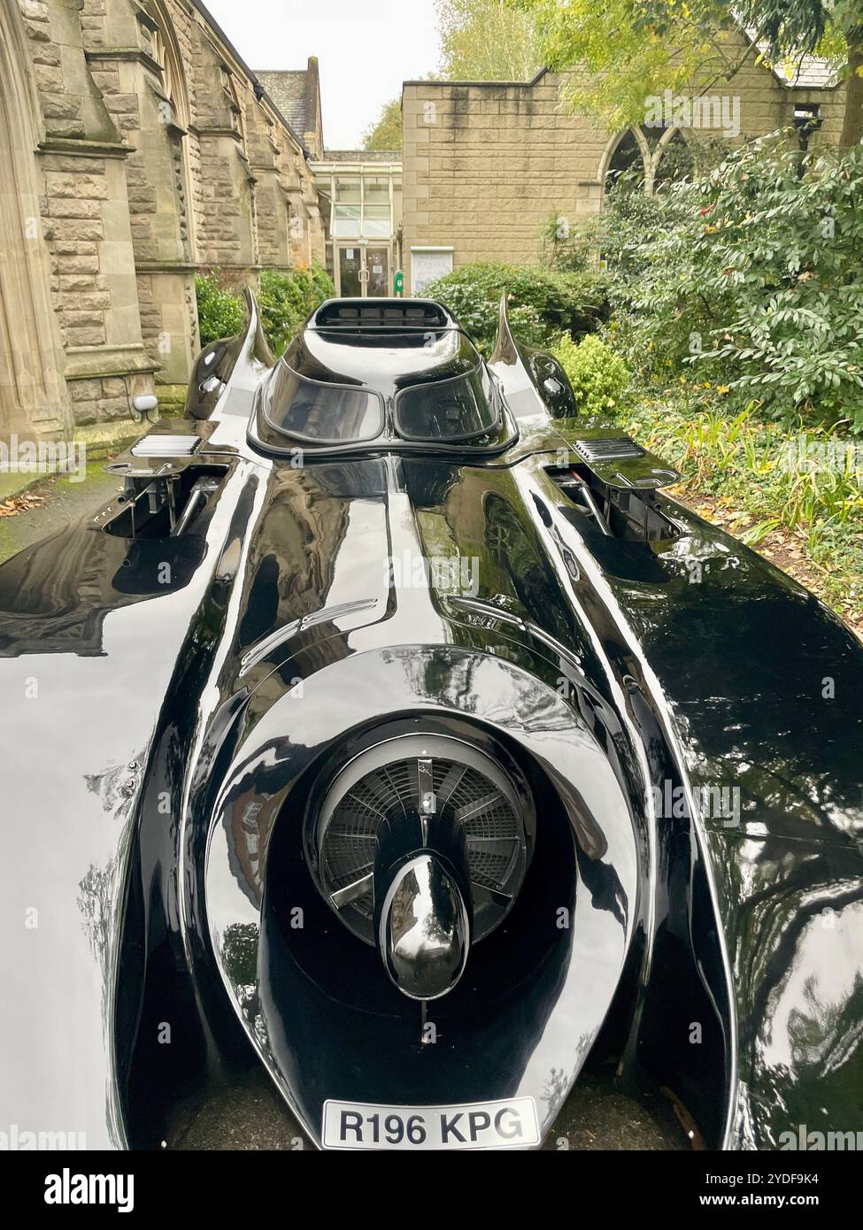 a replica of the bat mobile in a church grounds for use as a prop for a ...