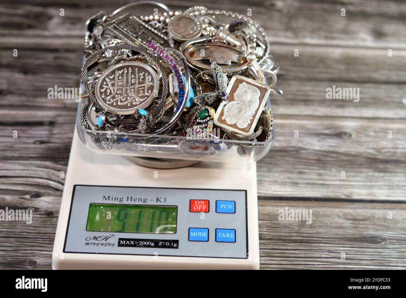 Cairo, Egypt, September 7 2024: Pile of silver on a digital Ming Heng ...