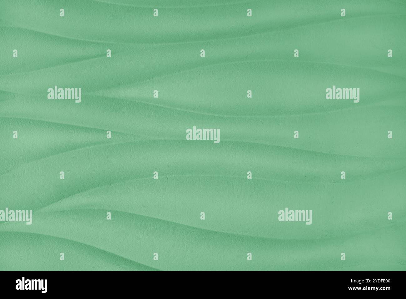 Plaster wall with volumetric relief surface wavy form pattern, green ...