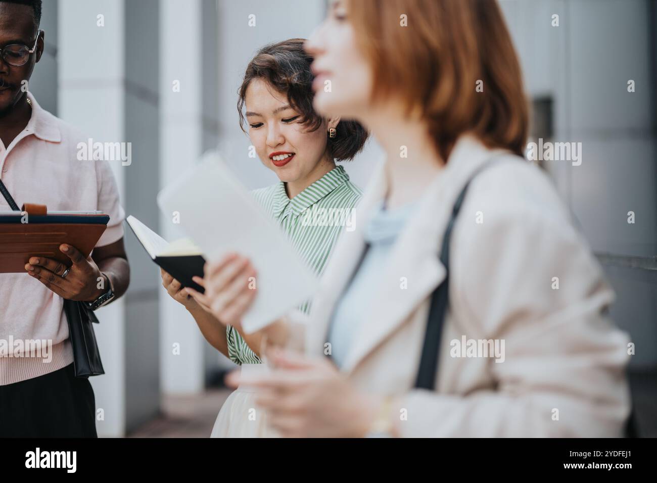 Multicultural team collaborating outdoor hi-res stock photography and ...
