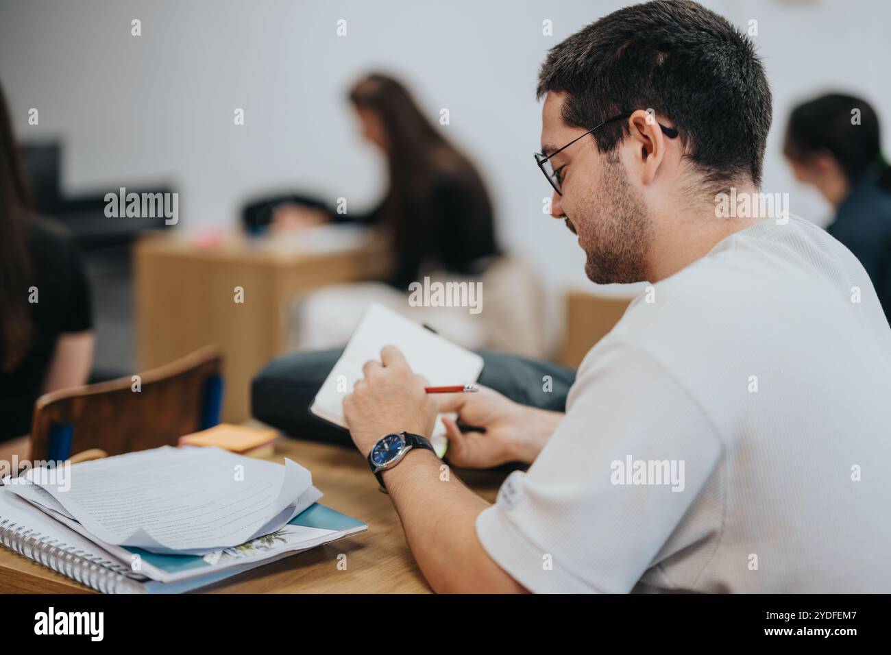 Focused high school students studying in a classroom setting Stock ...