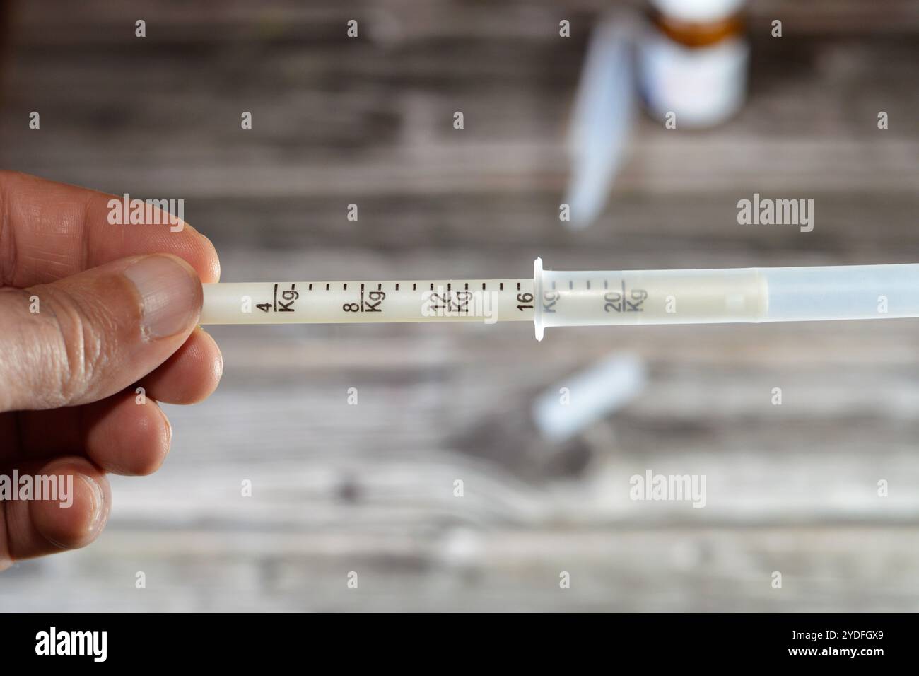 Graduated syringe in Kilograms KG for infants and children to calculate ...