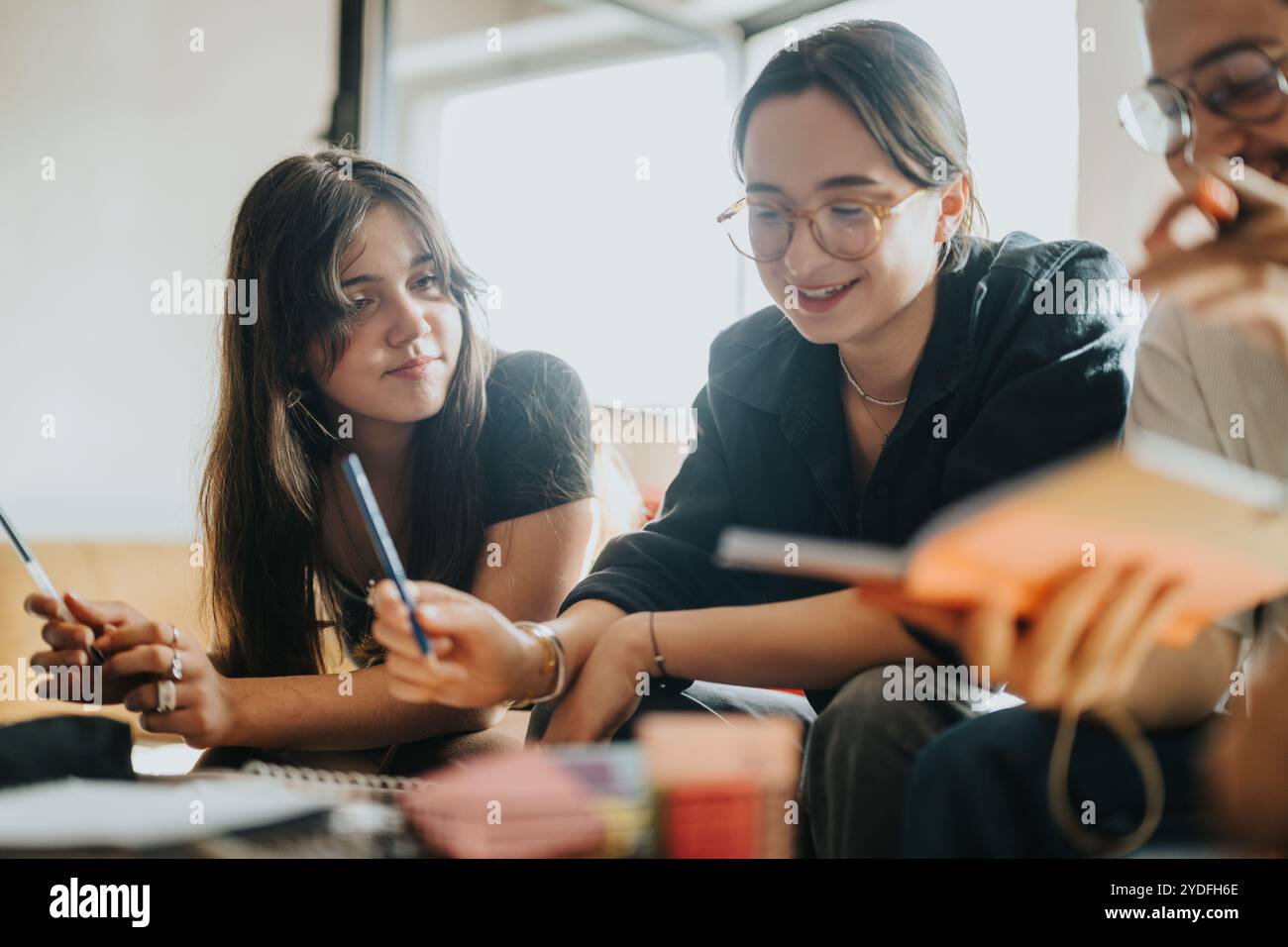 Students collaborating on a school project at study group Stock Photo ...