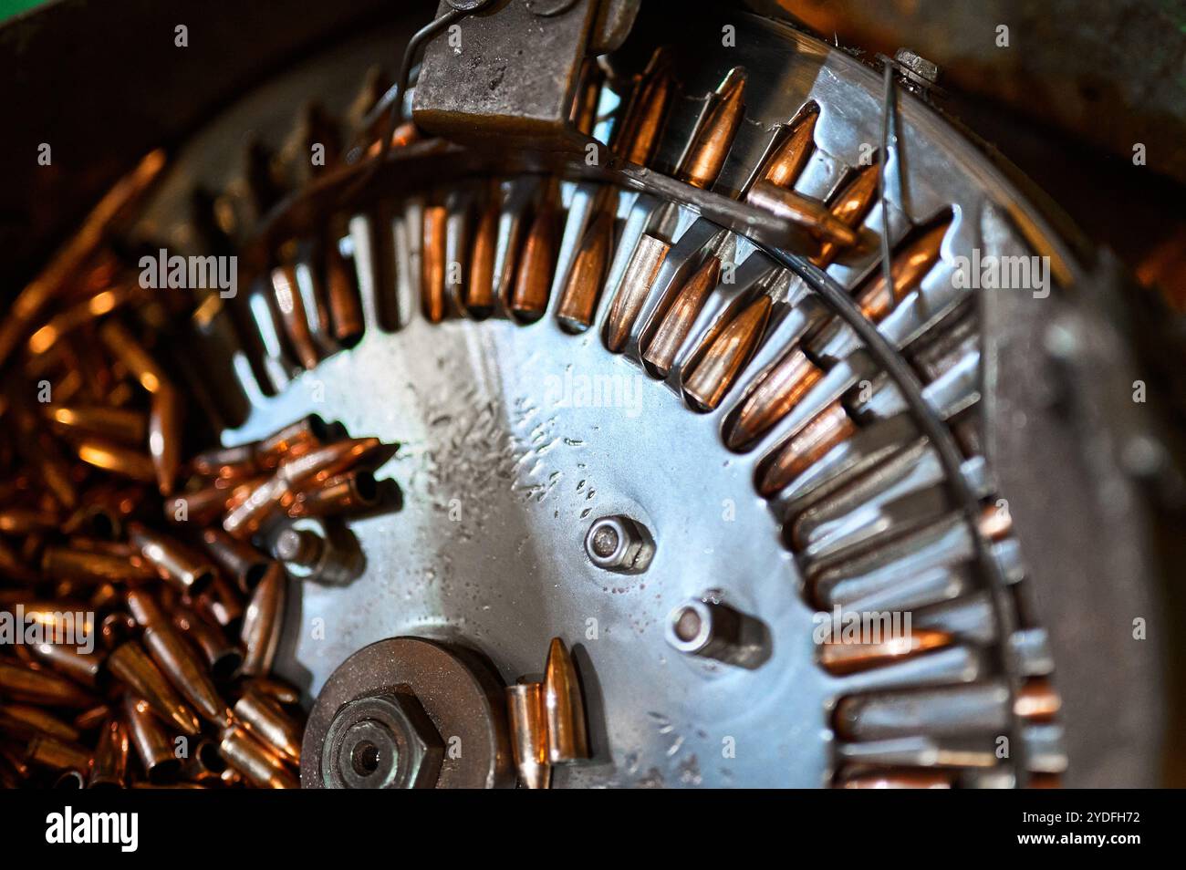 Pile of Copper bullet shells and turning wheel at production line Stock ...
