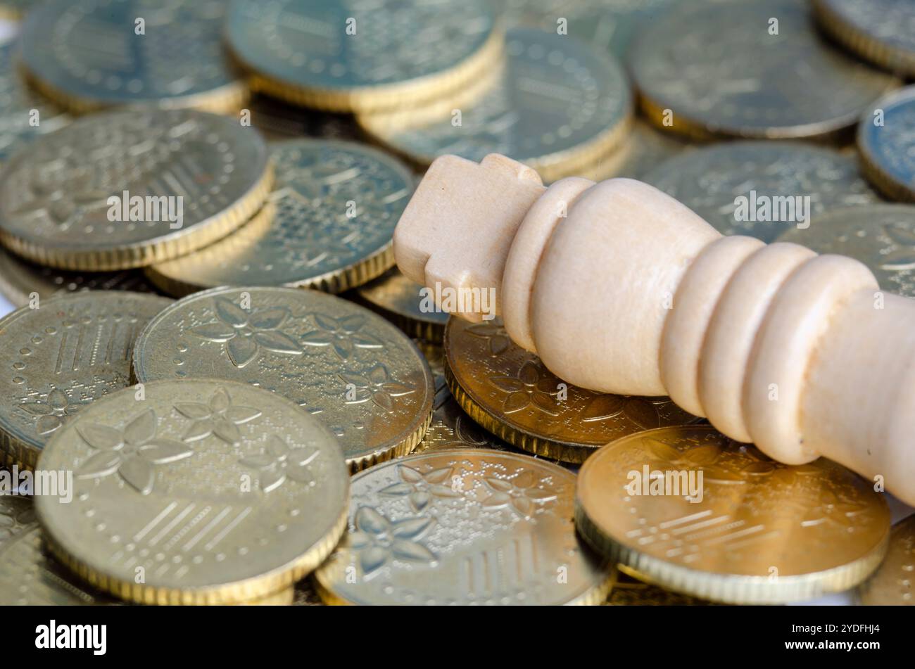 Close up of King chess on top of golden coins representing wealth and ...