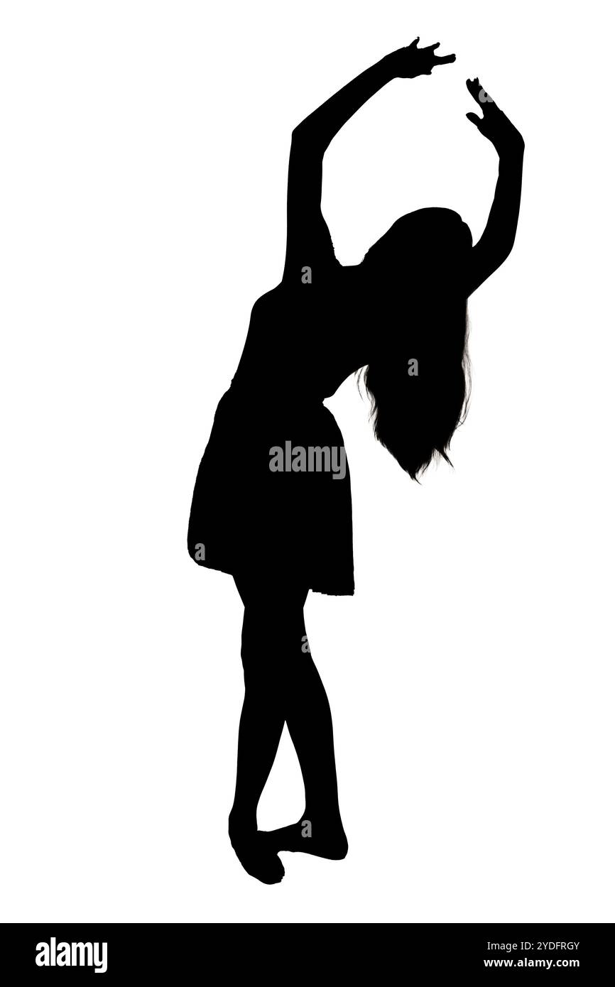 A beautiful silhouette of a graceful woman dancing elegantly and ...