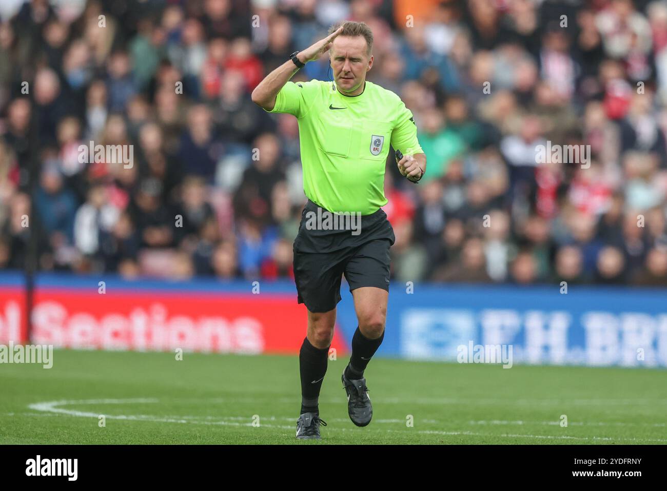 Referee Oliver Langford signals for help as Jamie Cumming of Oxford ...