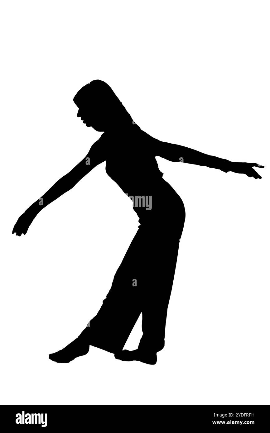 A graceful silhouette of a woman dancing joyfully with her arms ...