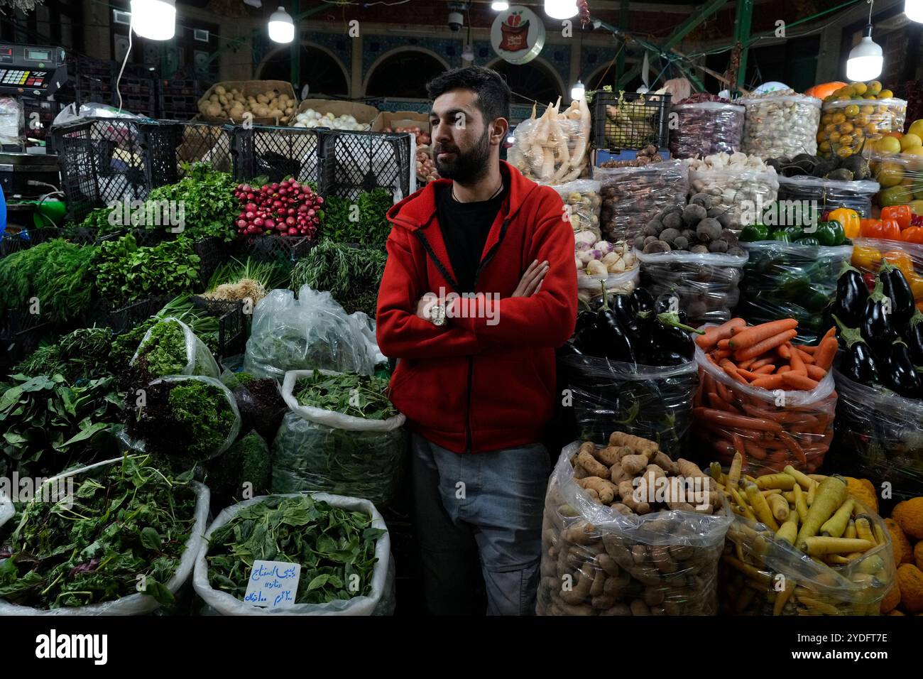 A grocery seller waits for customers at Tajrish traditional bazaar in ...