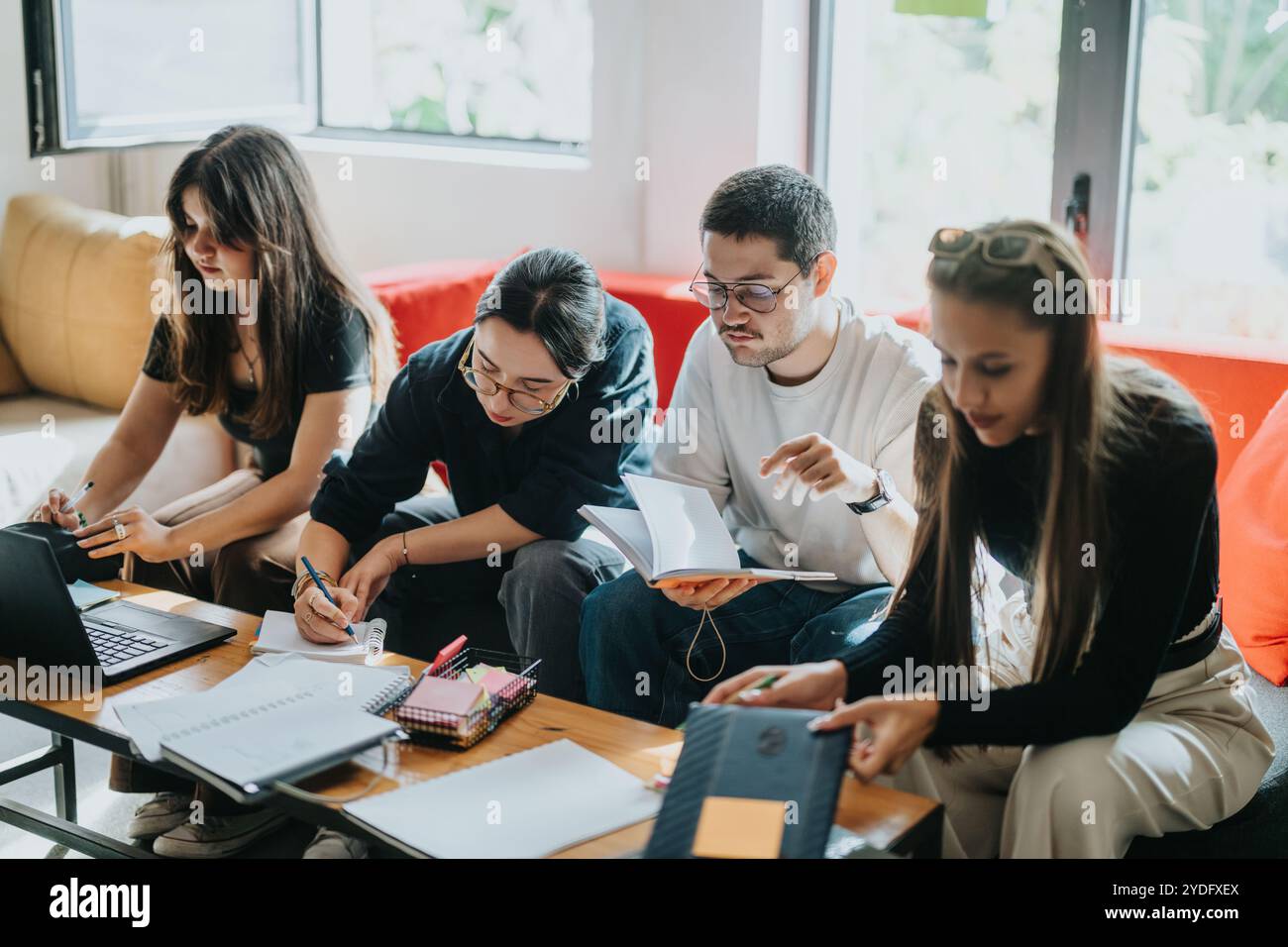 Students collaborating on school tasks in a cozy study room Stock Photo ...