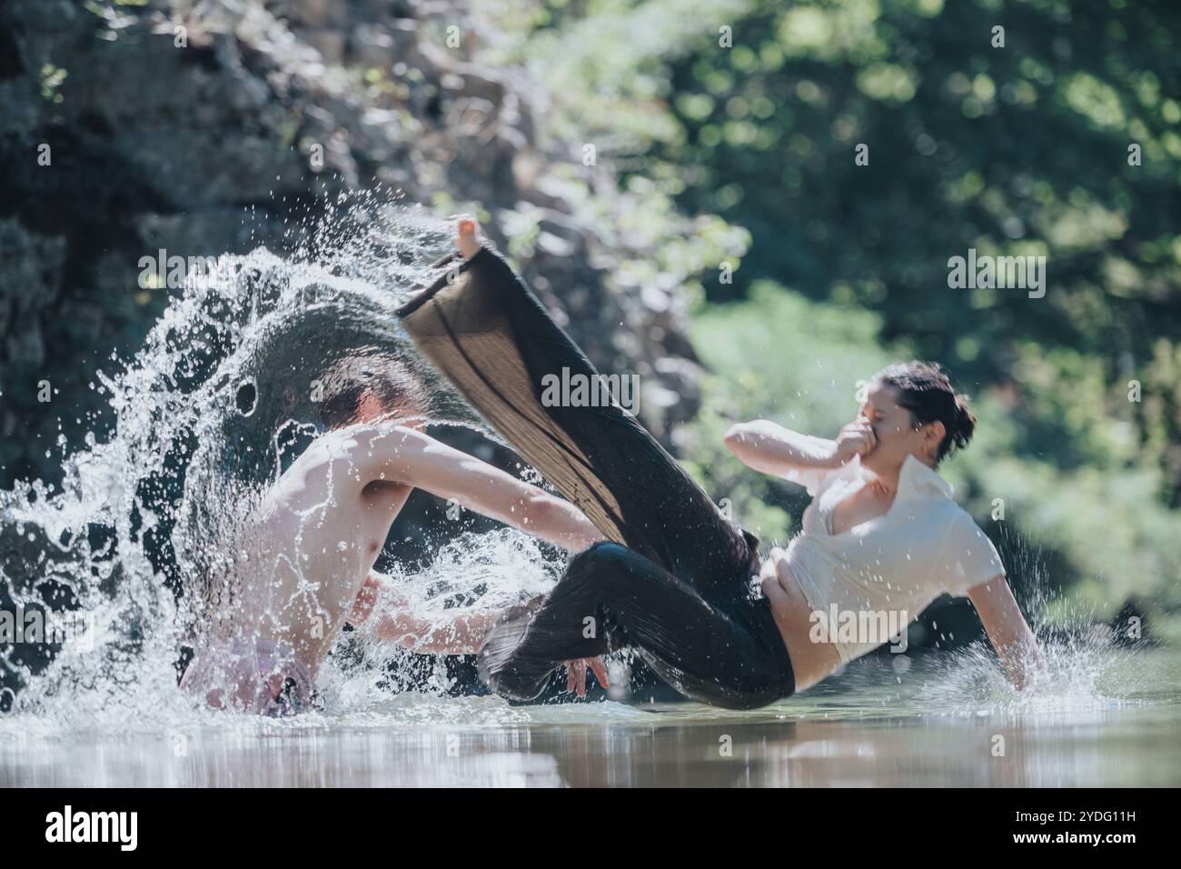 Joyful splash in the river with friends during summer Stock Photo - Alamy