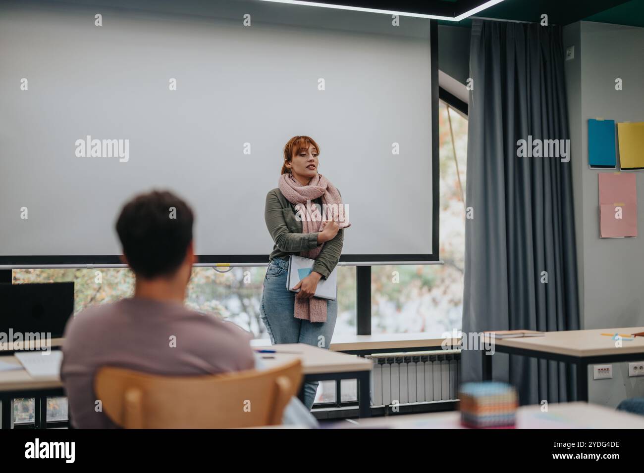 Young student presenting a project in a modern classroom setting Stock ...