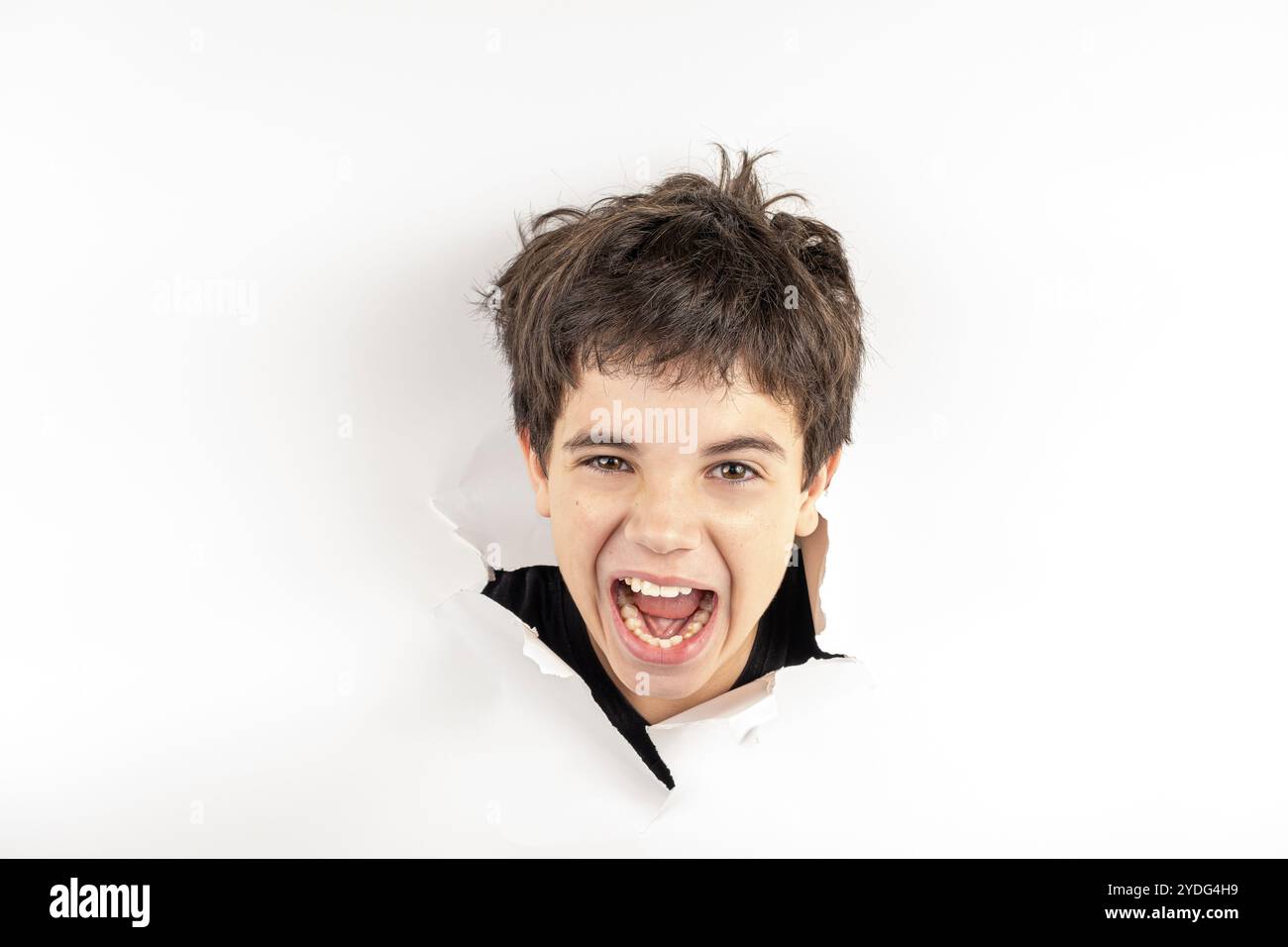 11 year old Brazilian child with only his head on a torn cardboard ...