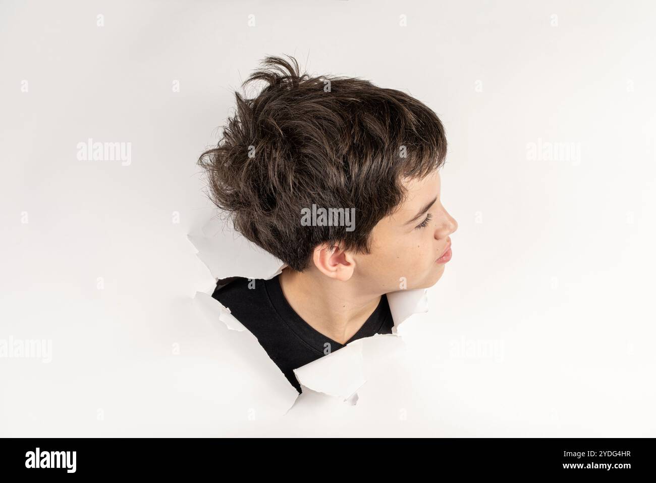 11 year old Brazilian child with only his head on a torn cardboard ...