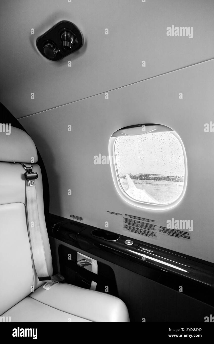 NetJets Embraer Phenom 300 interior with rain drops on the window Stock ...