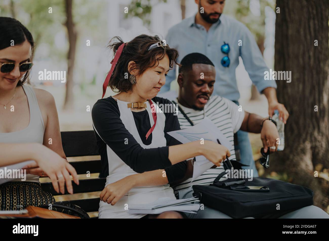 Business people collaborating in a relaxed outdoor setting Stock Photo ...