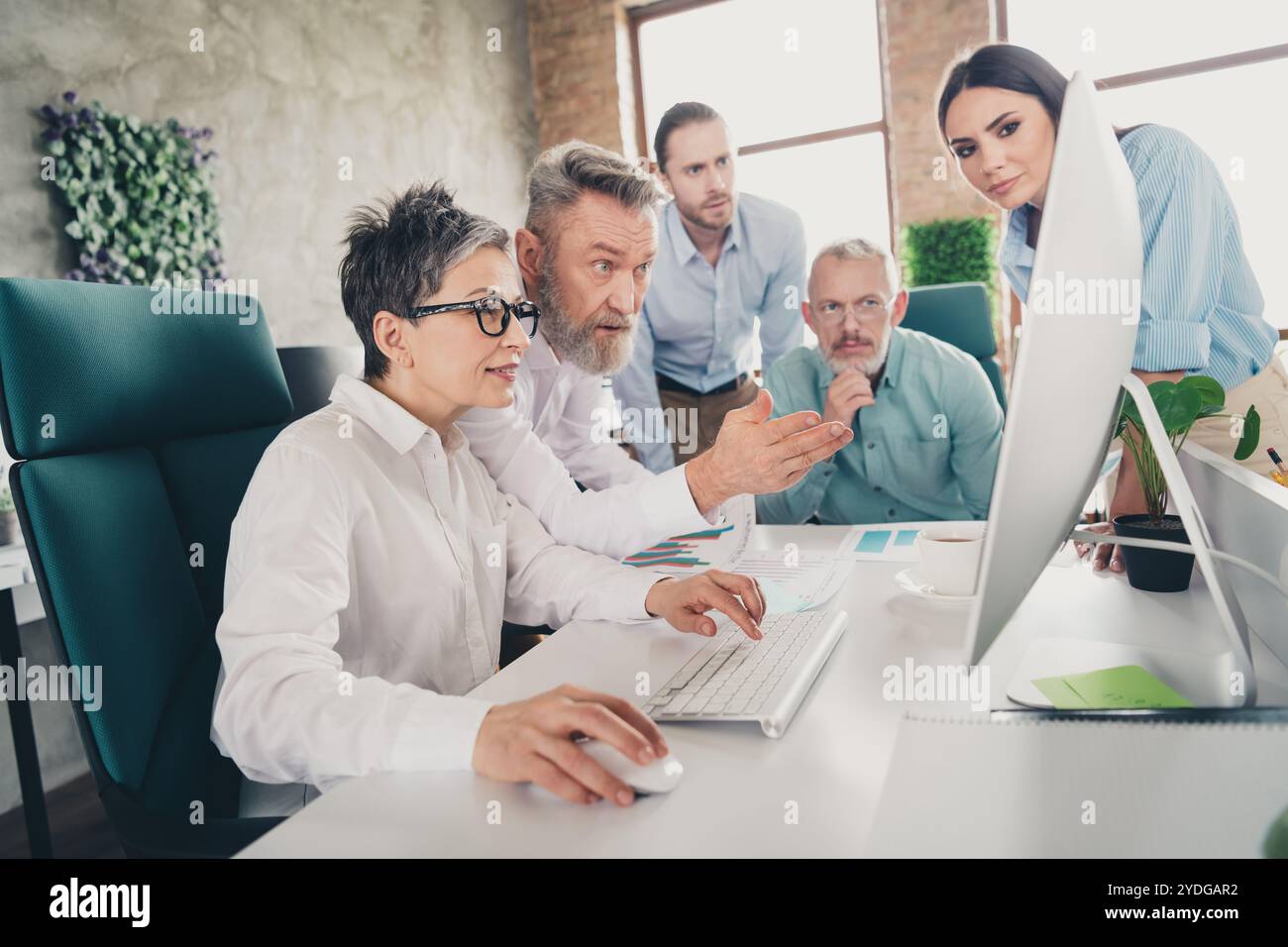 Photo of teamwork people working together networking computer employees ...
