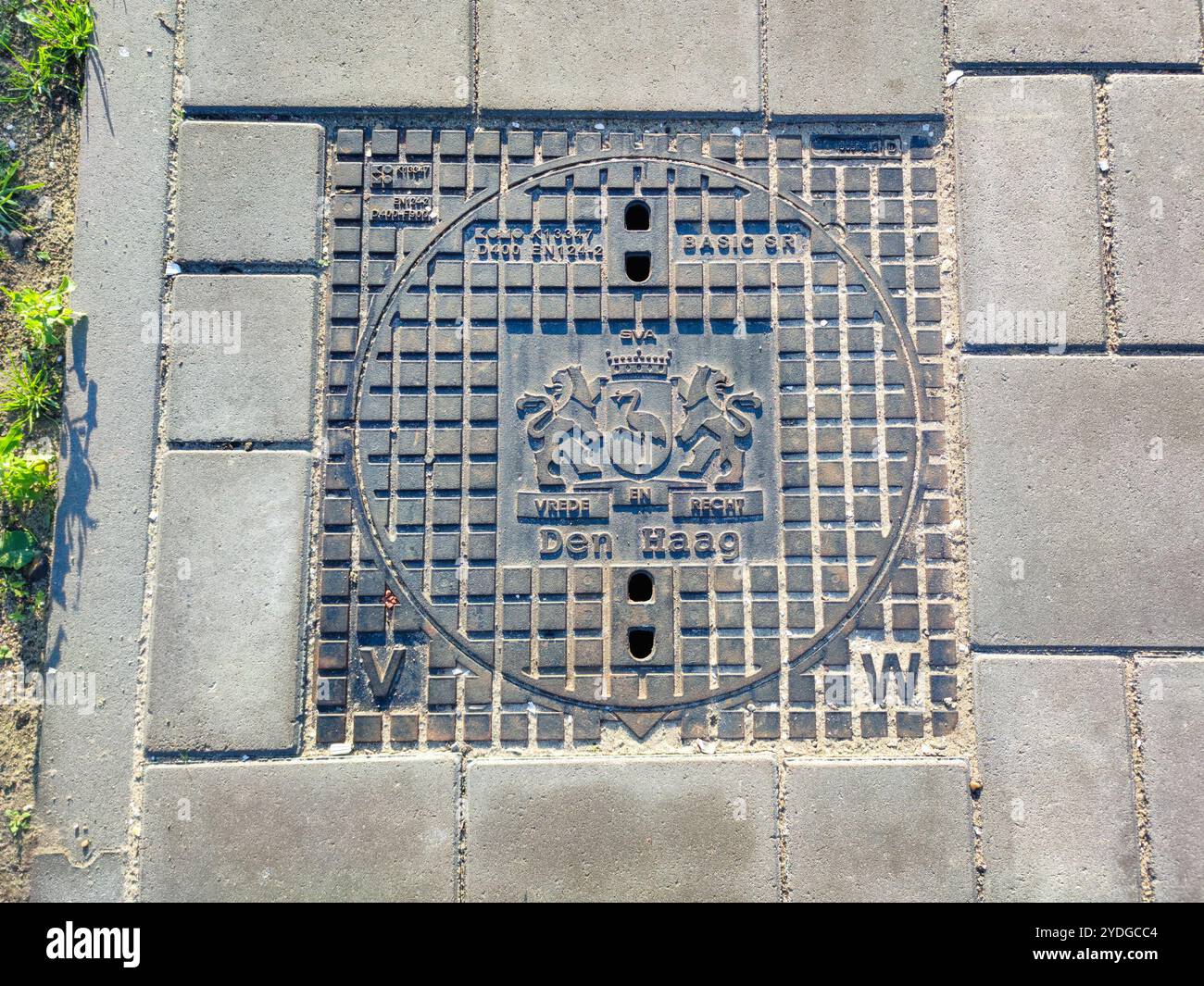 Well cover with city arms of The Hague, Netherlands Stock Photo - Alamy