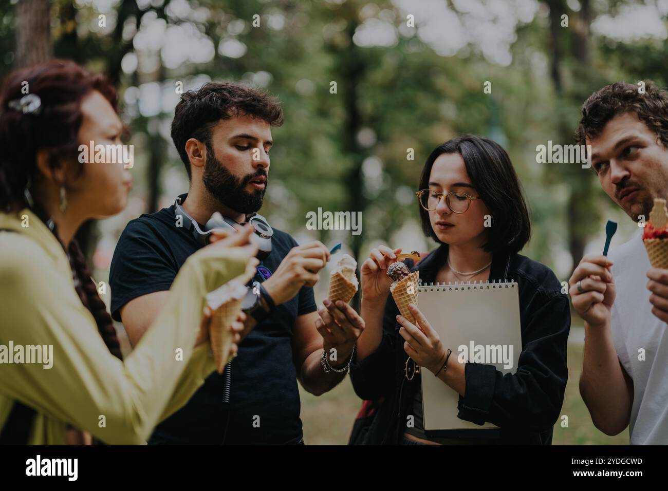 Group of students and professor enjoying ice cream outdoors after class ...