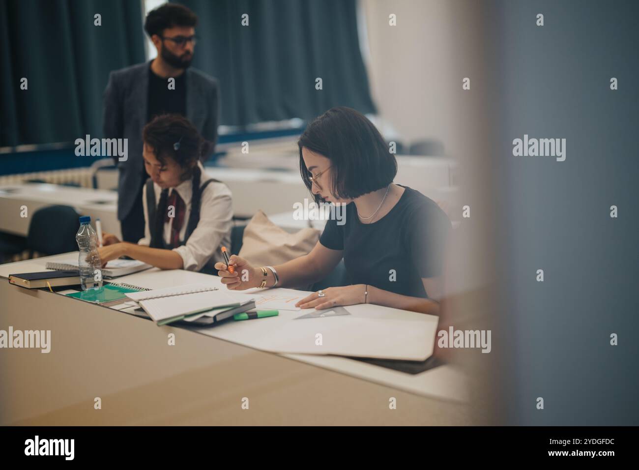 Students engaged in a collaborative learning environment at school ...